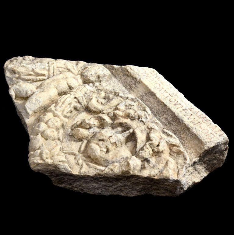 Roman fragment of sarcophagus depicting a Gorgon and Eros with libertus ...