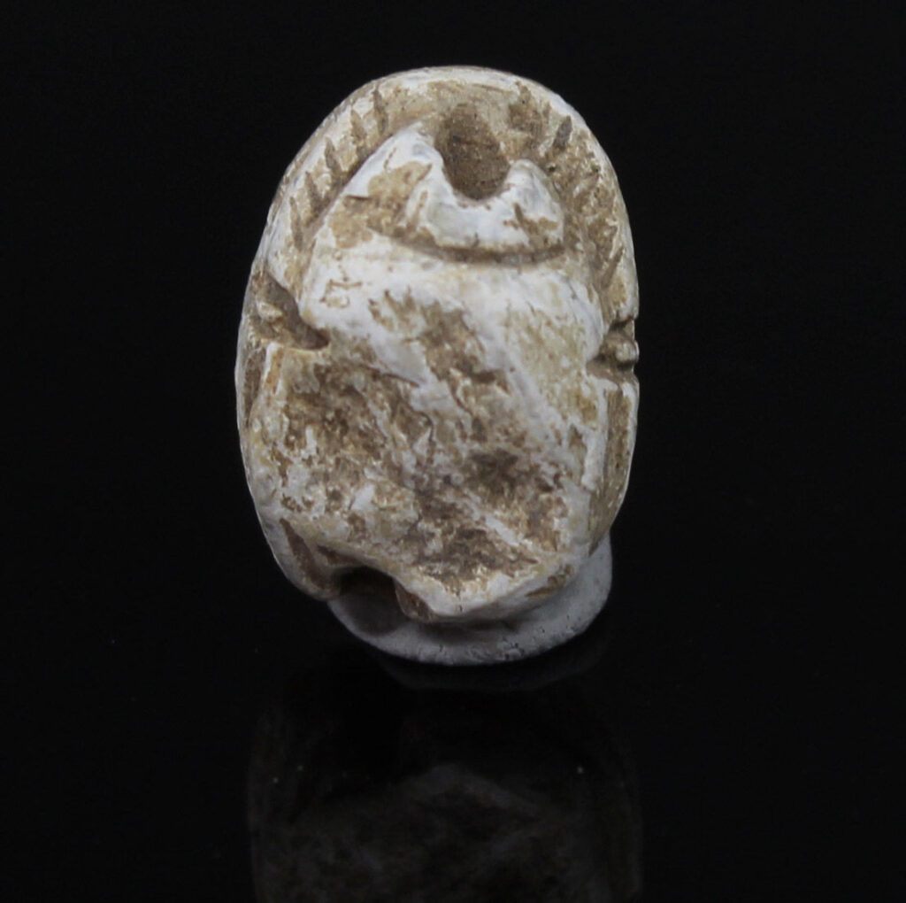 Egyptian scarab with beetle holding solar disk flanked by uraeus ...