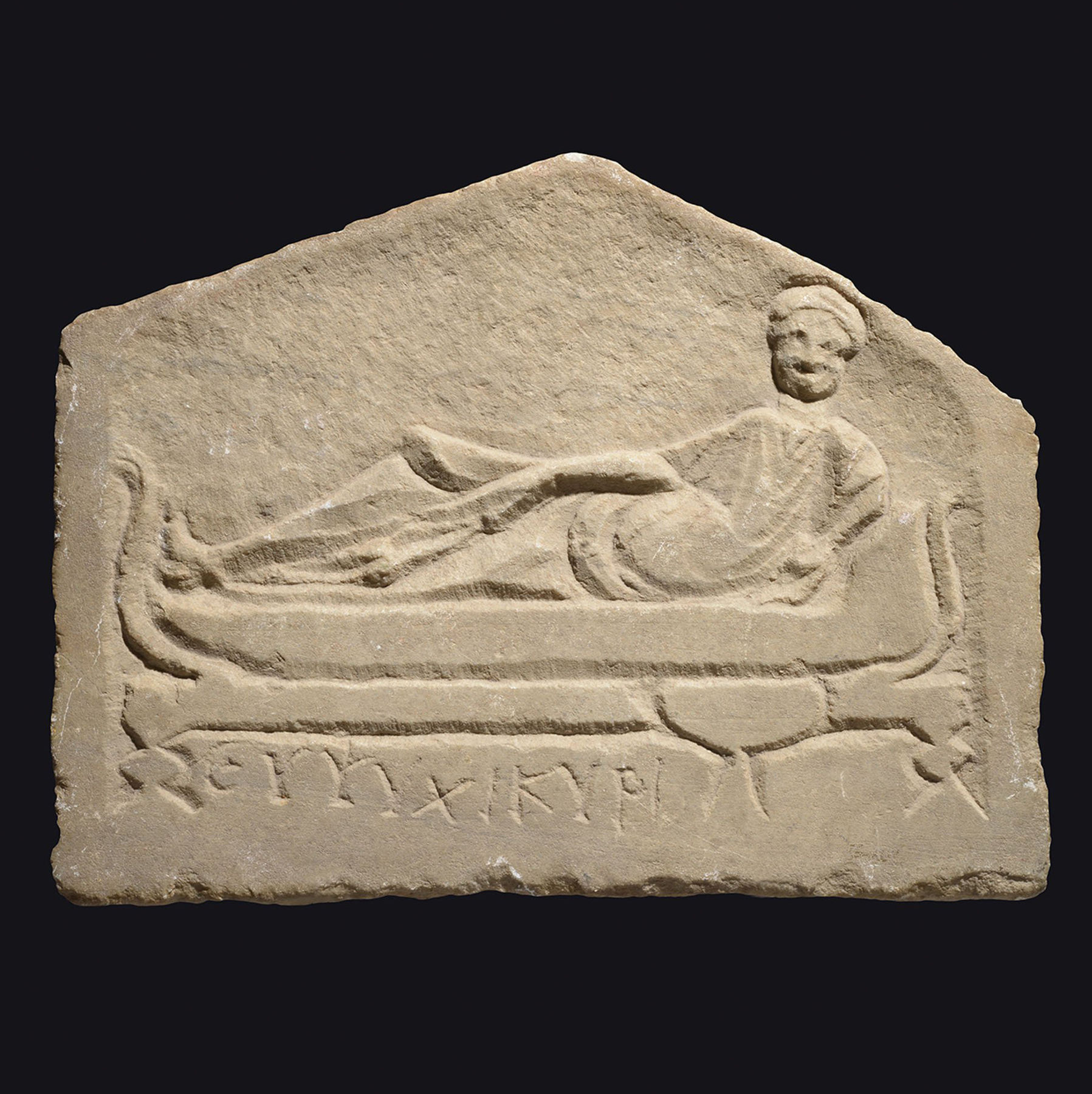 Roman funerary stele depicting a symposium with Greek inscription ...